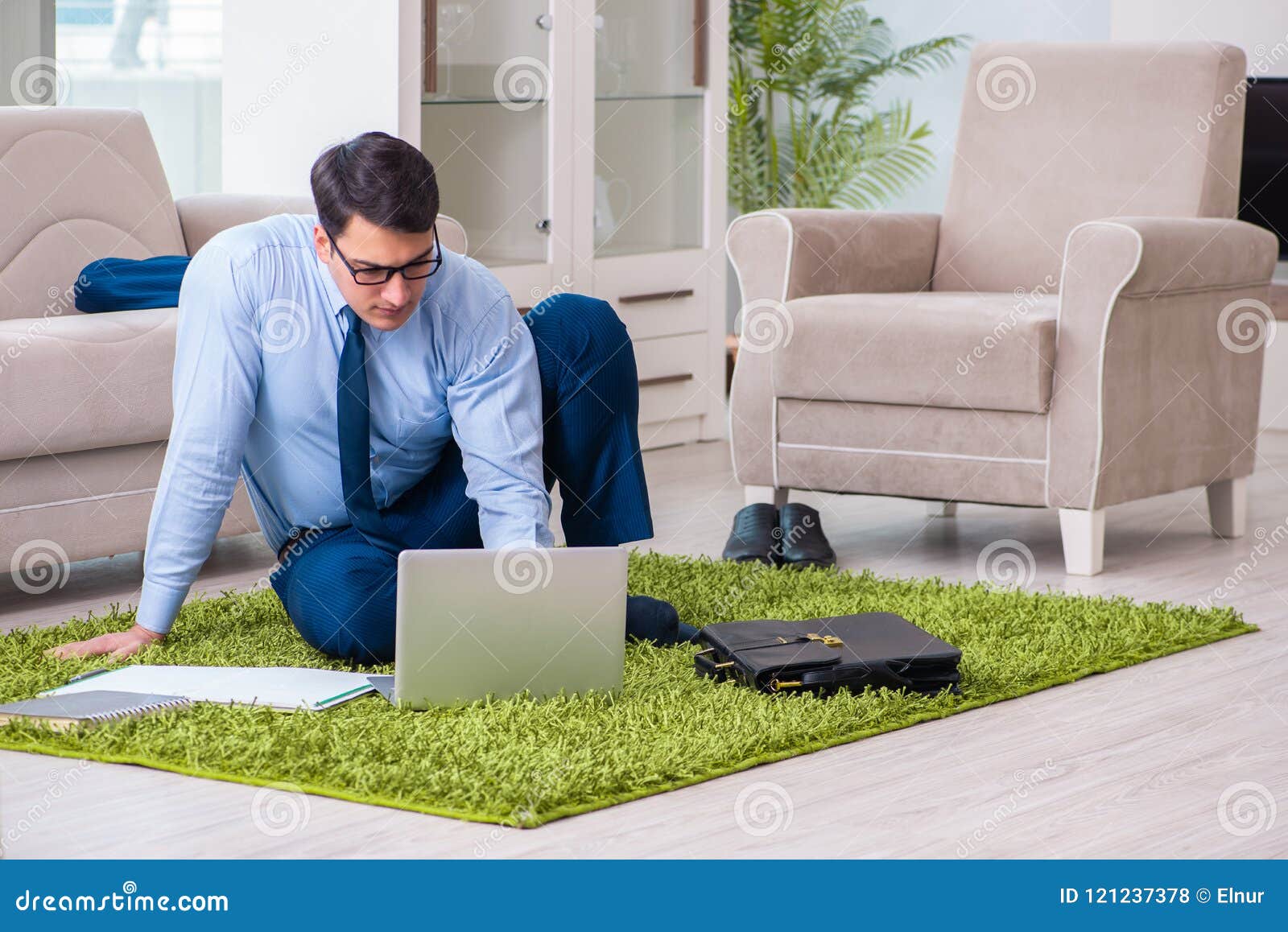 The Businessman Taking Work Home and Working Overtime Stock Photo ...