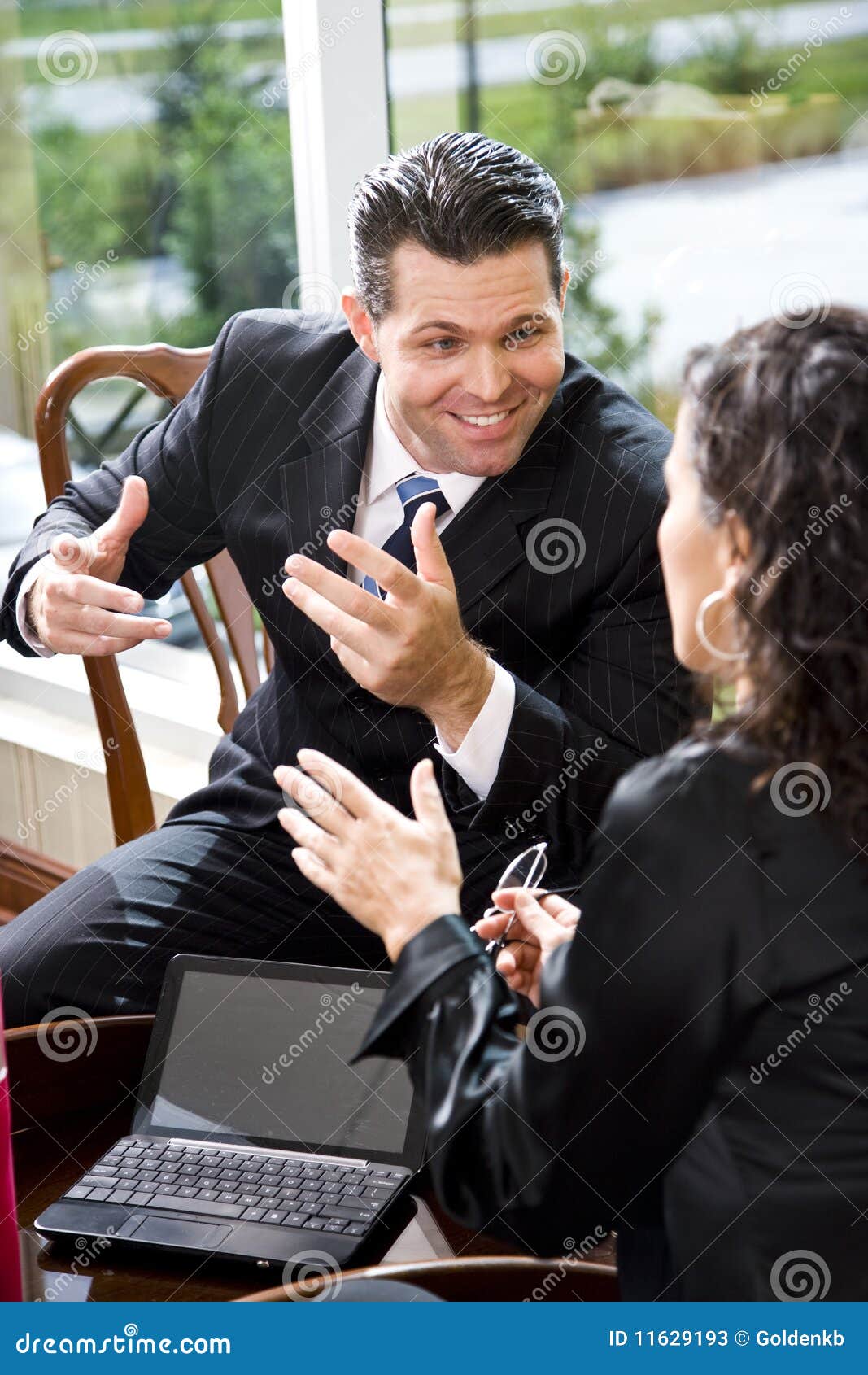 Businessman Talking with Female Hispanic Coworker Stock Image - Image ...
