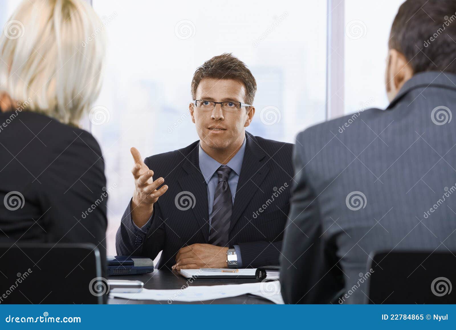 Businessman Talking at Meeting Stock Image - Image of colleagues ...