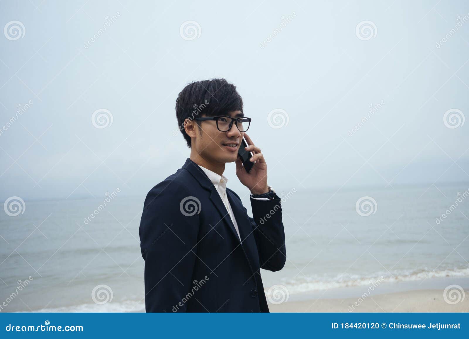 Businessman Talking on a Phone at the Beach Stock Photo - Image of ...