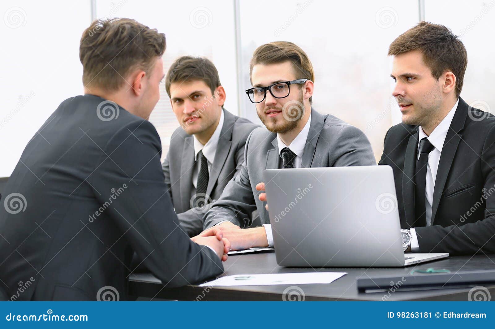 Businessman Talking To a Business Team at a Desk Stock Image - Image of ...