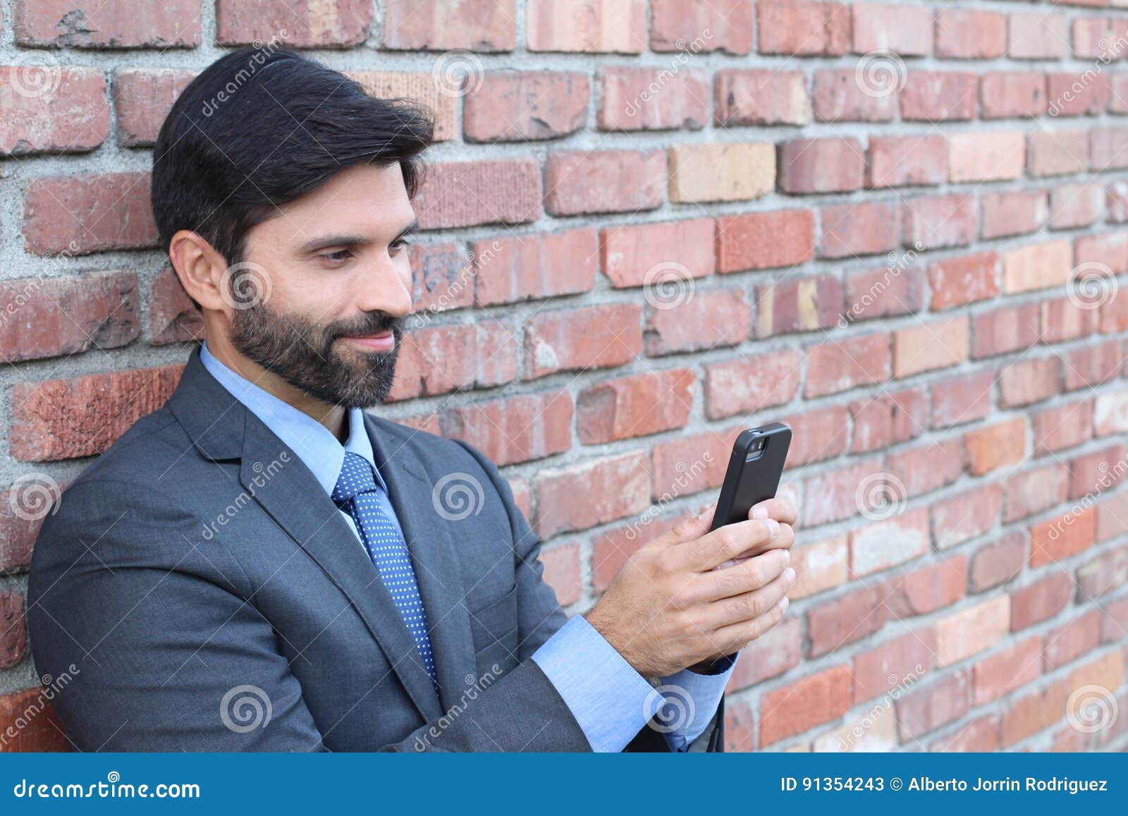Businessman Texting with His Smartphone in the Office Stock Image ...