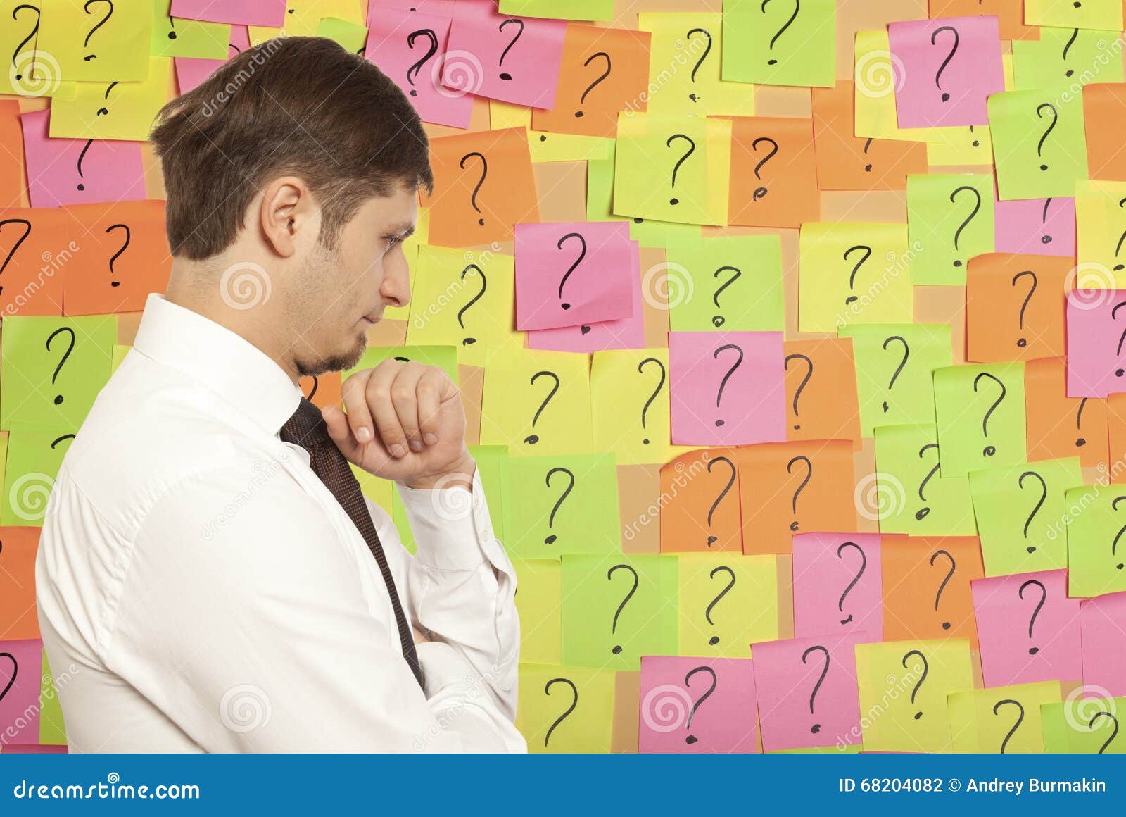 Businessman Thinking with Question Marks Written Stock Photo - Image of ...