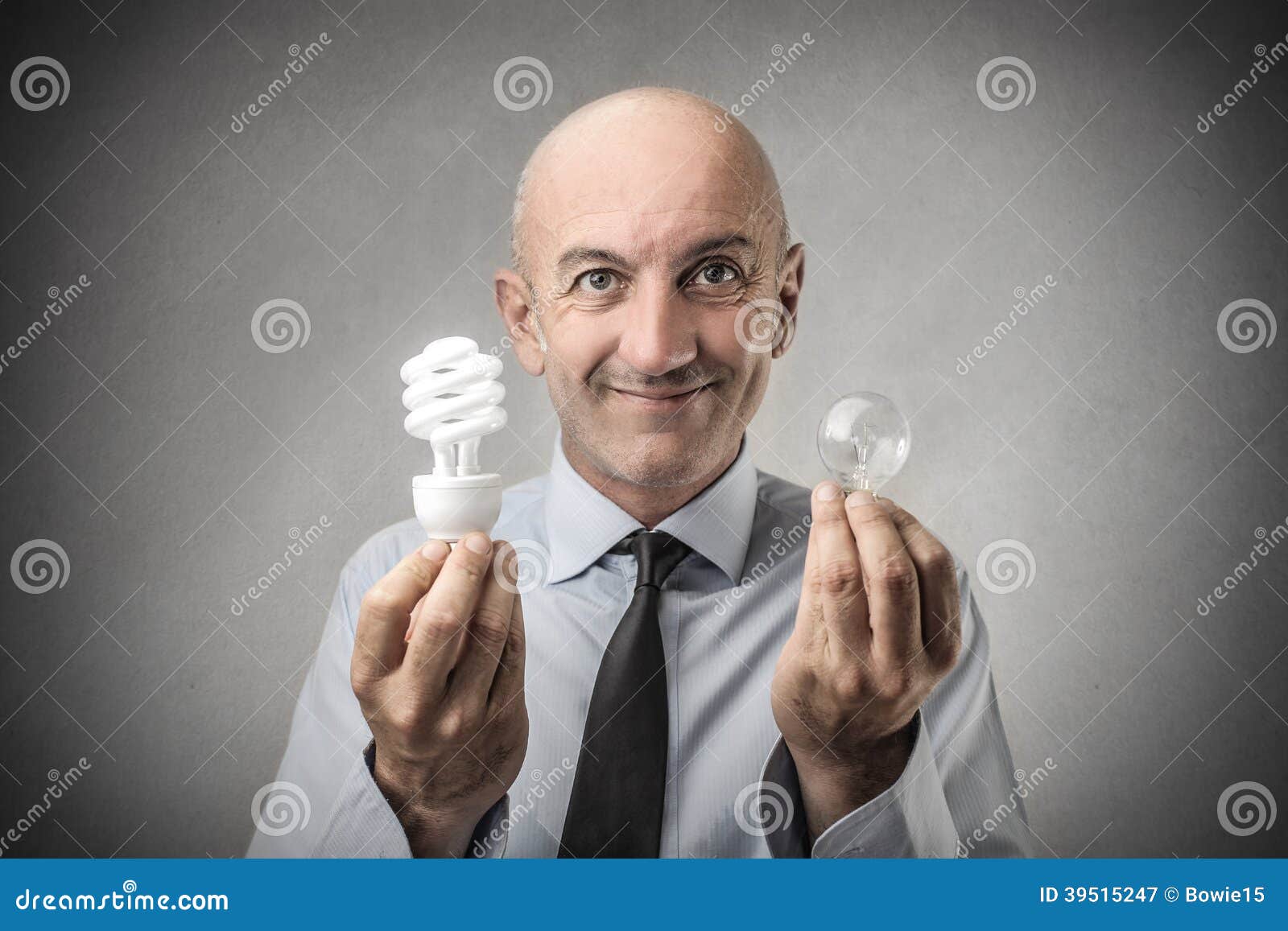 Businessman with Two Light Bulbs Stock Image - Image of smile, choose ...