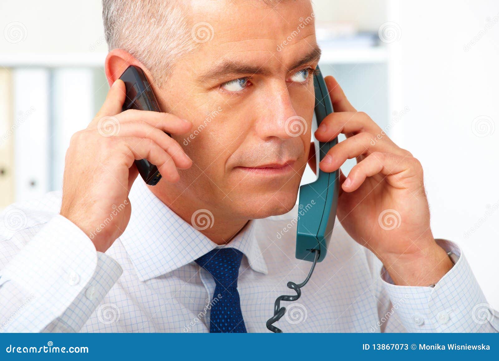 Businessman with Two Phones Stock Image - Image of aged, corporate ...