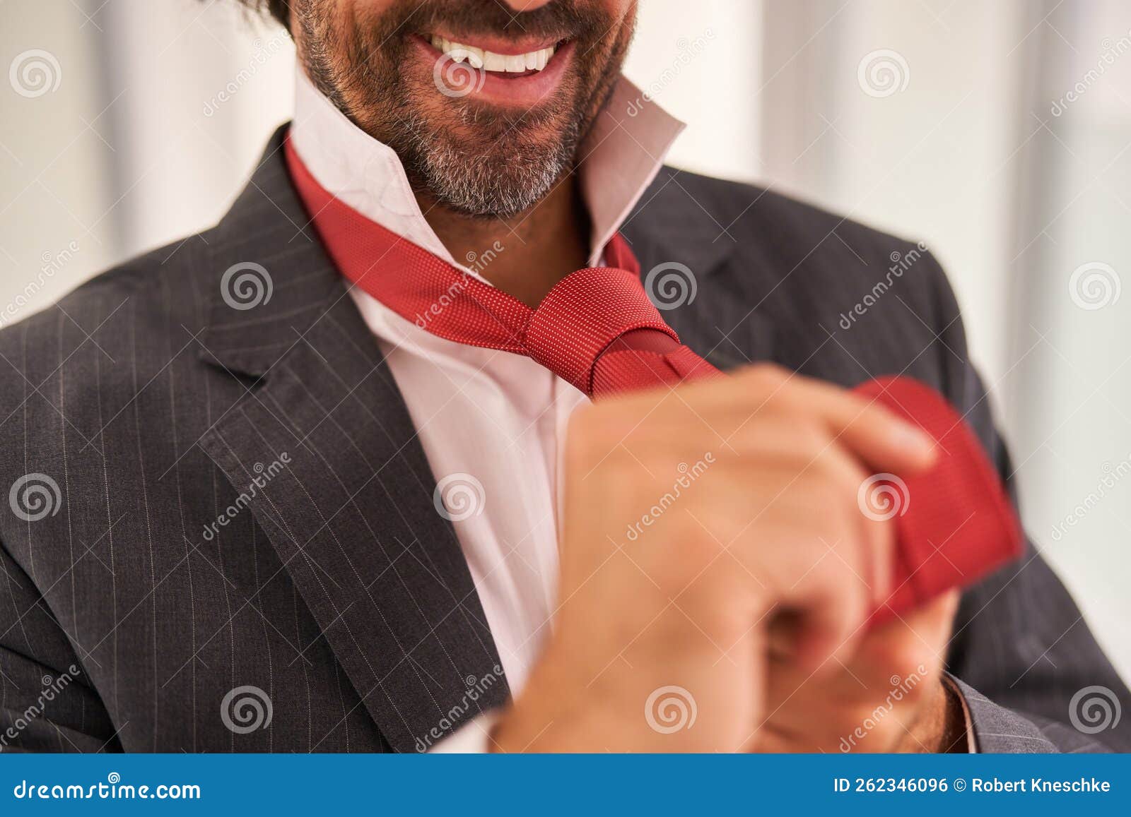 Businessman Tying Tie in Office Stock Photo - Image of store, necktie ...