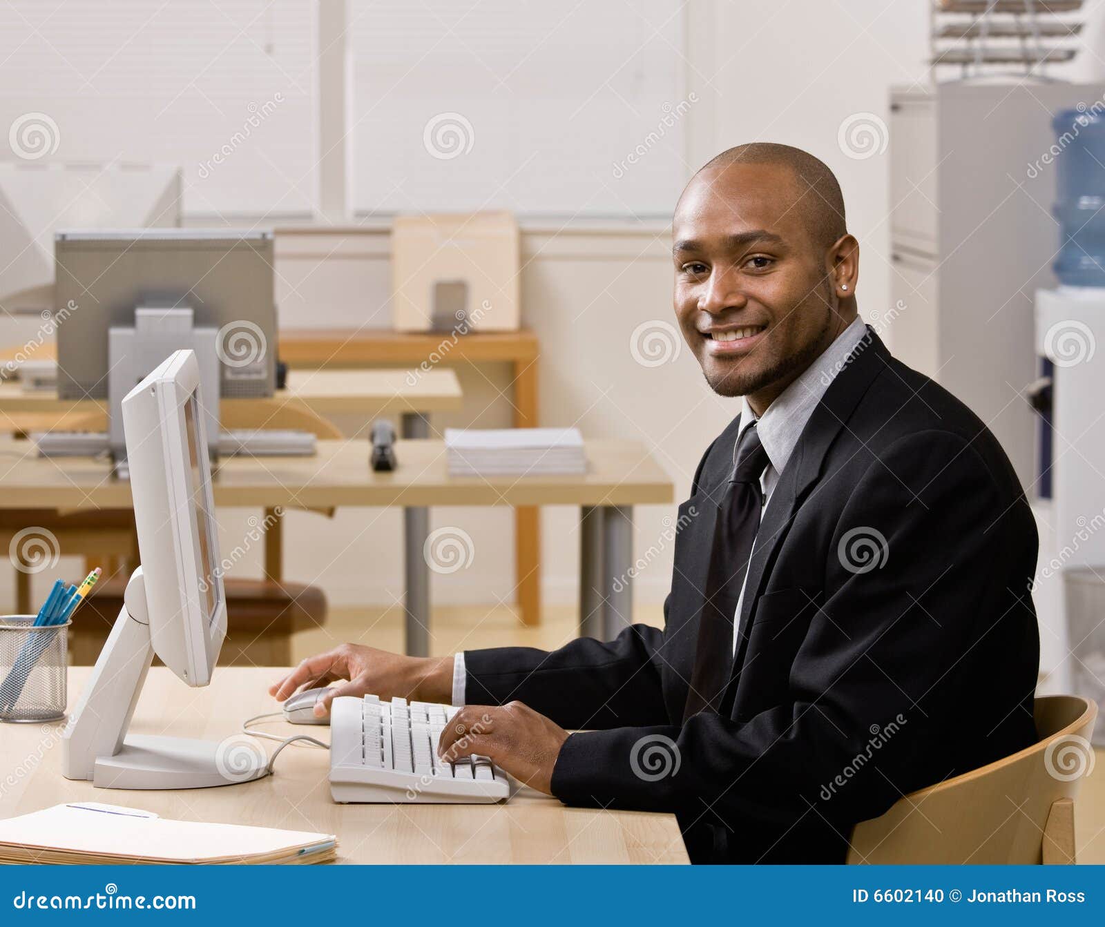 Businessman Typing on Computer at Desk Stock Photo - Image of people ...