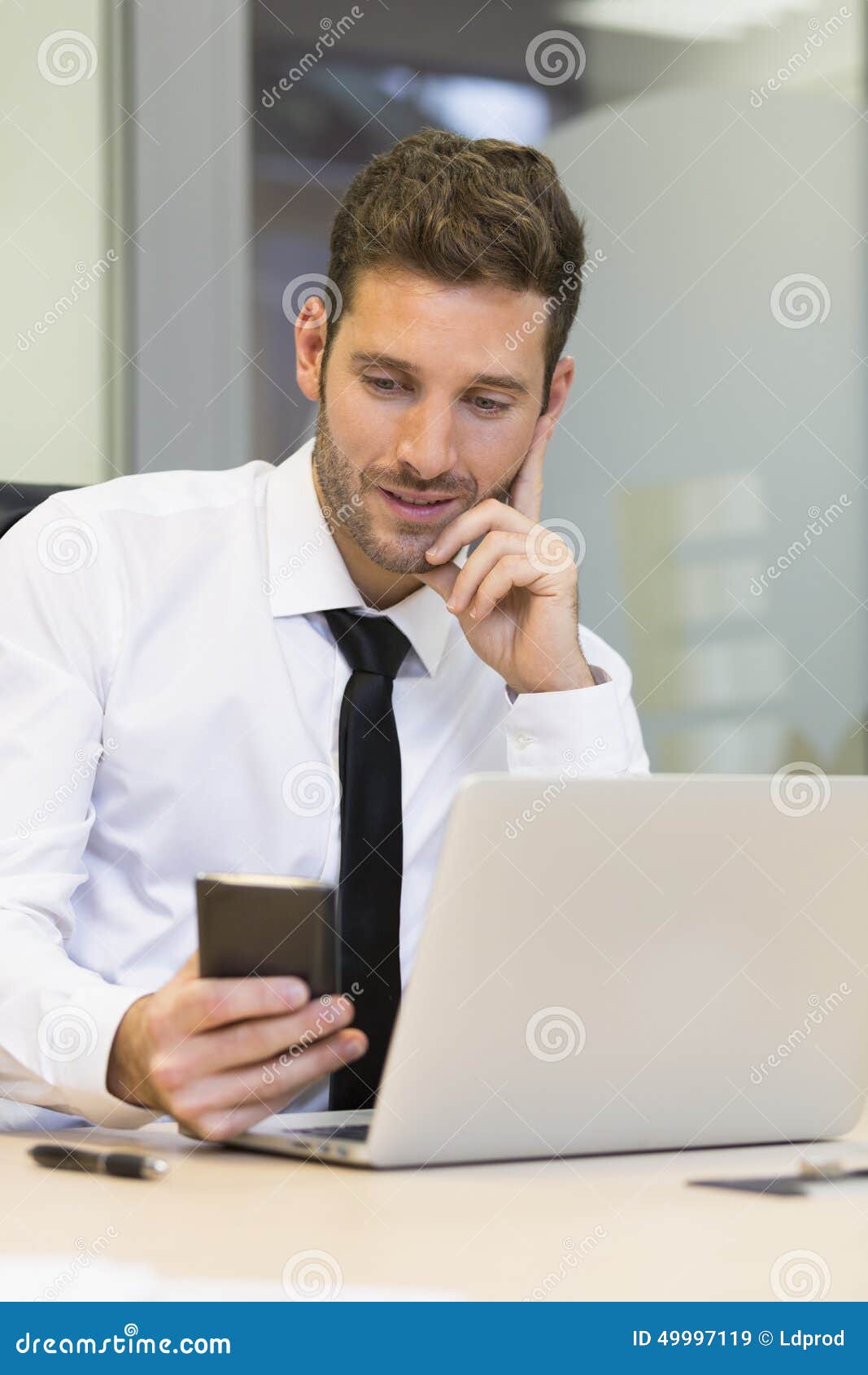 Businessman Typing a Message on Mobile Phone in Office Stock Image ...