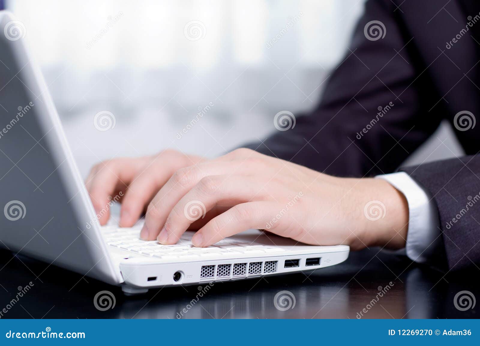 Businessman Typing on a Notebook Stock Photo - Image of finger, suit ...