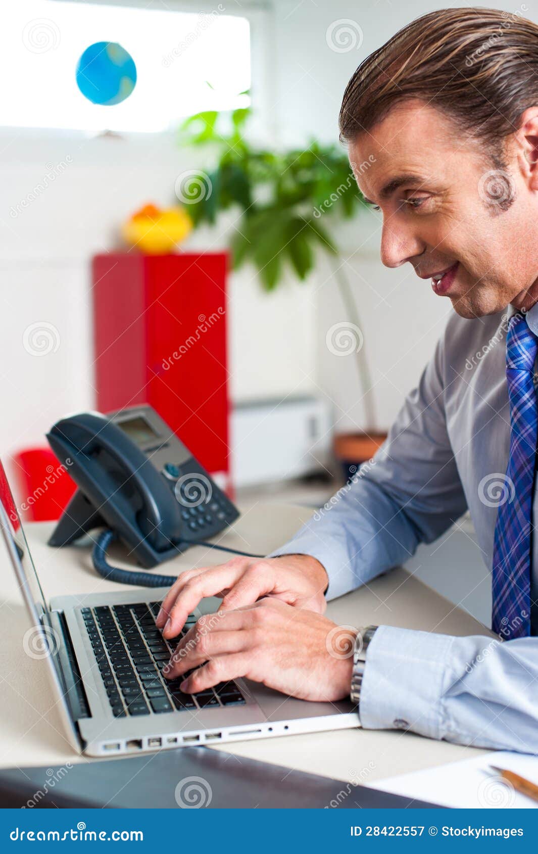 Businessman Typing Report on a Laptop Stock Image - Image of globe ...