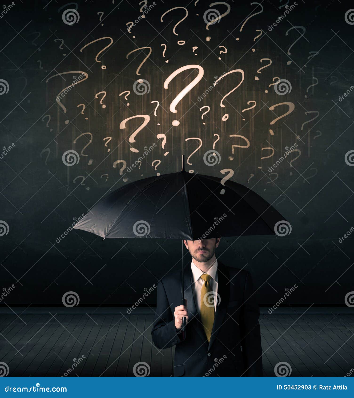Businessman with Umbrella and a Lot of Drawn Question Marks Stock ...