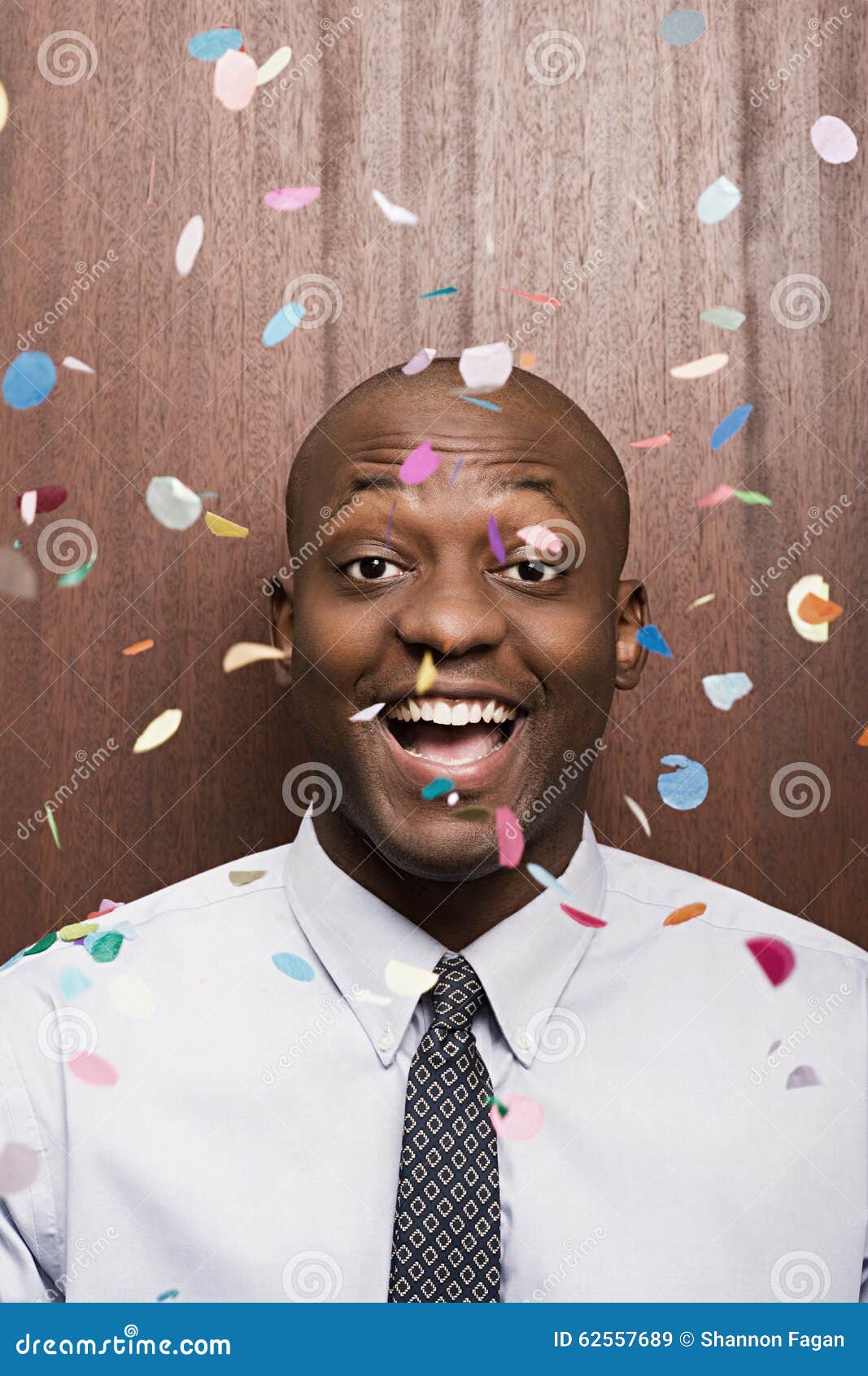 Businessman Under Falling Confetti Stock Image - Image of elation ...
