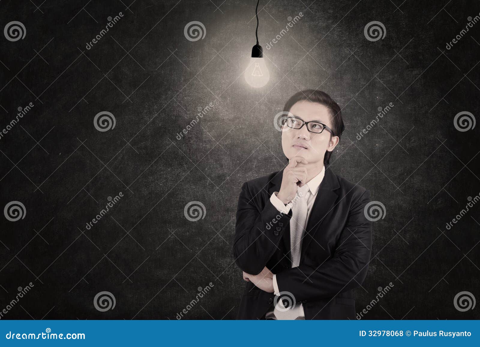 Businessman Under Lit Bulb Thinking of Idea Stock Photo - Image of ...