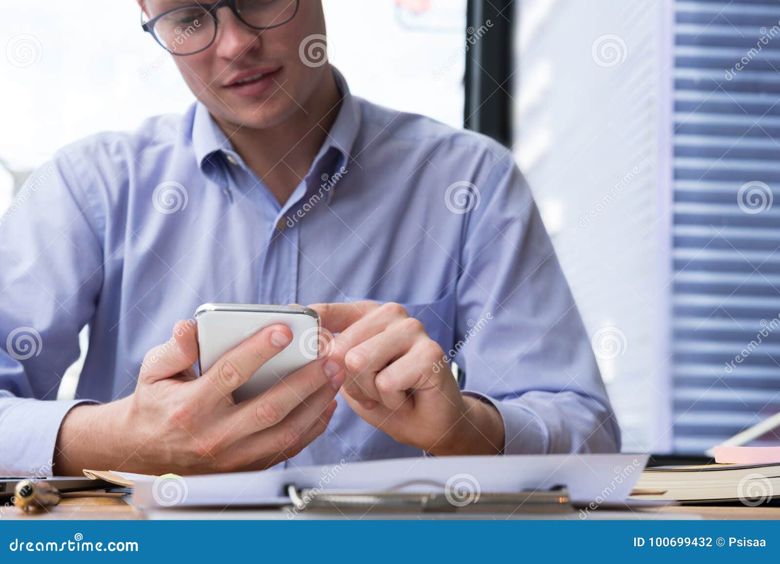 Businessman Use Mobile Phone at Workplace. Man Texting Message O Stock ... Businessman Use Mobile Phone at Workplace. Man Texting Message O Stock ...