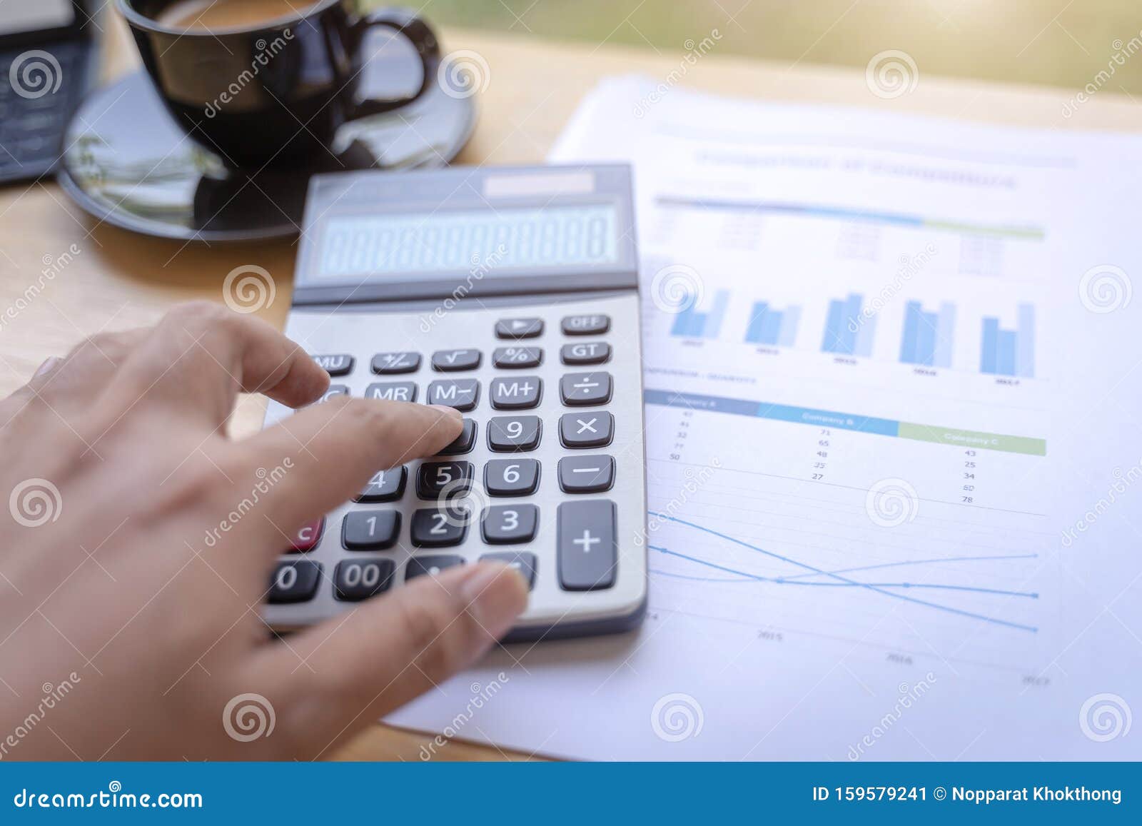 Businessman Using Calculator for Calculating with Finance Paper, Tax ... Businessman Using Calculator for Calculating with Finance Paper, Tax ...