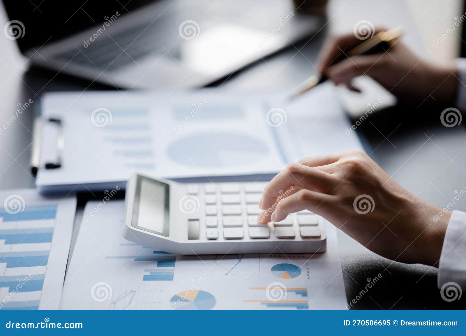 Businessman is Using a Calculator To Calculate Company Financial ... Businessman is Using a Calculator To Calculate Company Financial ...