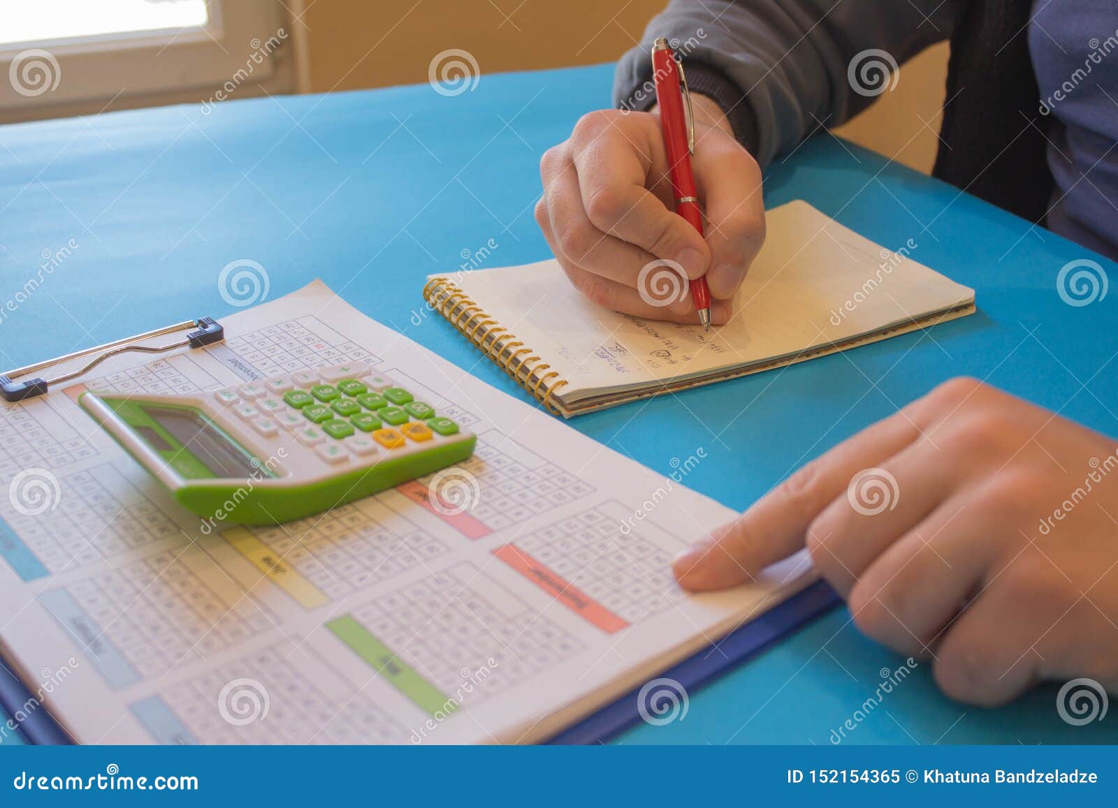Businessman Using a Calculator To Calculate the Numbers. Businessman ...