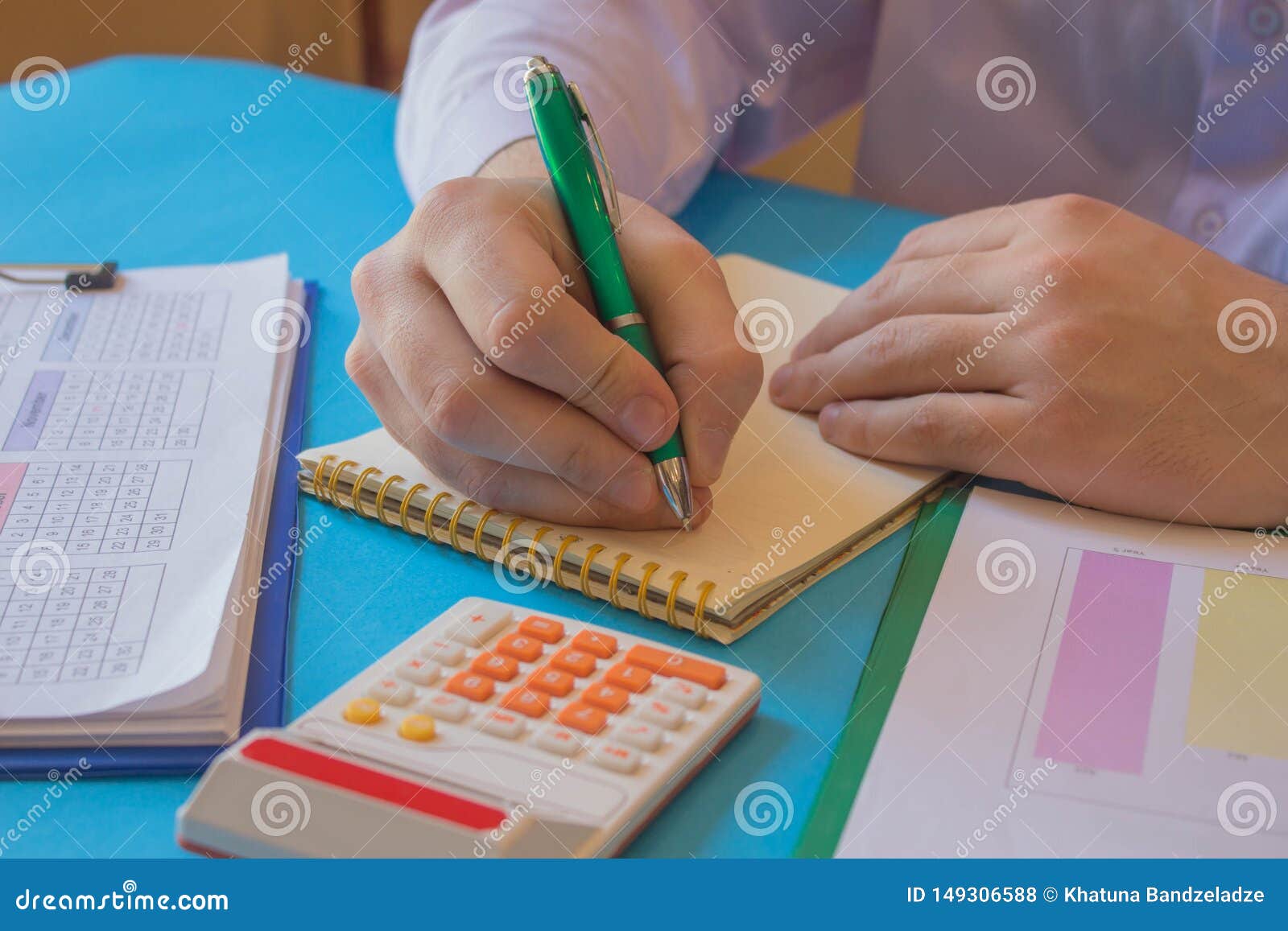 Businessman Using a Calculator To Calculate the Numbers. Businessman ...