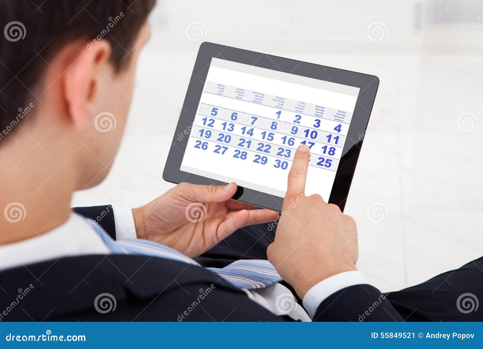 Businessman Using Calendar on Digital Tablet in Office Stock Image ...