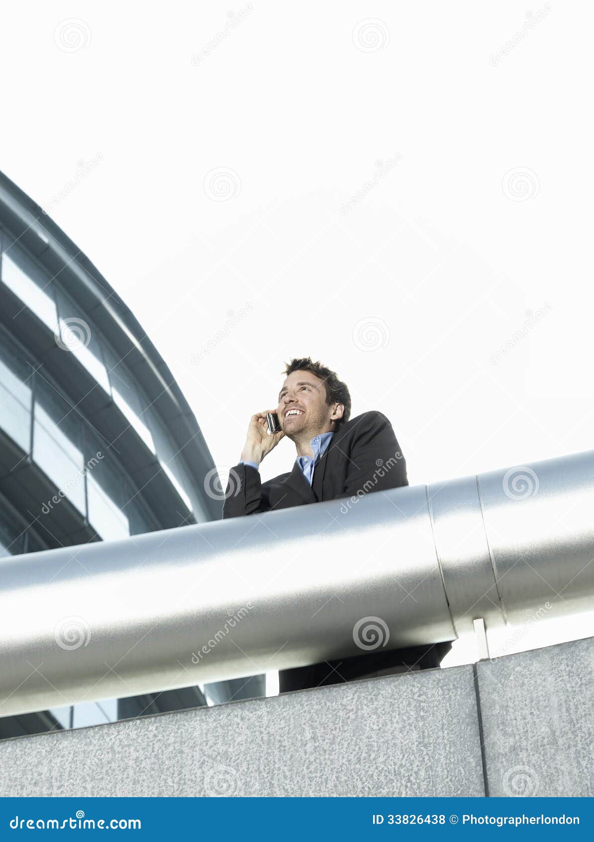 Businessman Using Cell Phone Outside Office Building Stock Photo ...