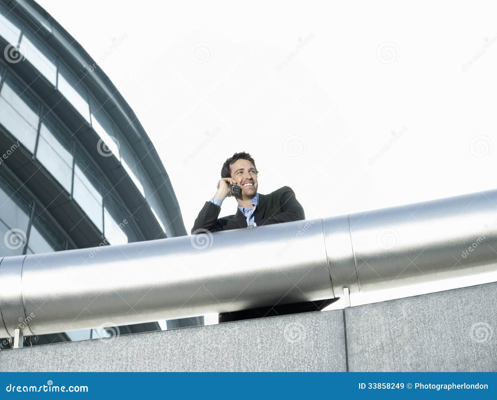 Businessman Using Cell Phone Outside Office Building Stock Image ...