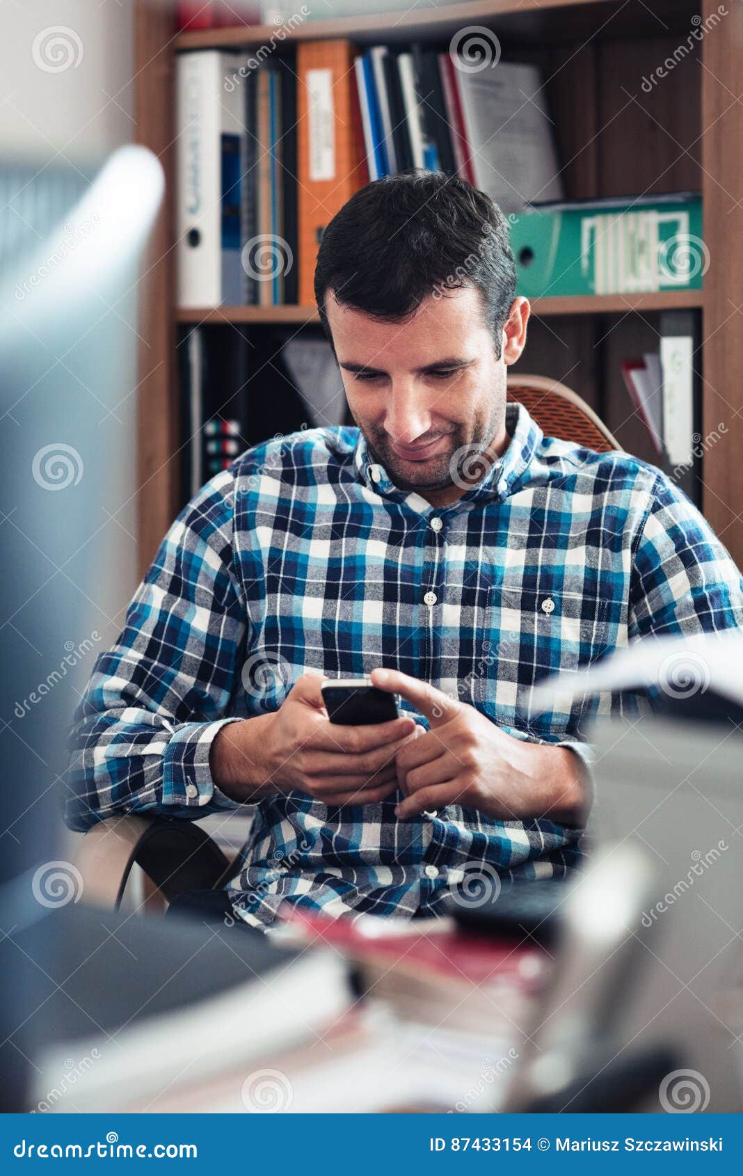 Businessman Using a Cellphone in an Office Stock Photo - Image of ...
