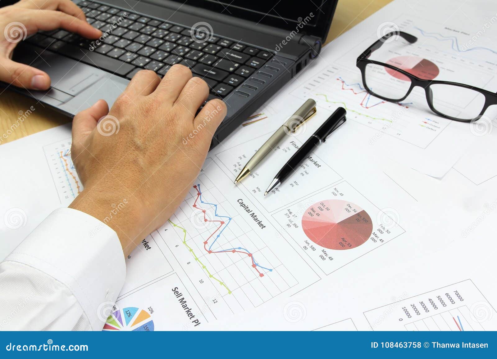 Businessman Using Computer Calculator with Business Graph Analyzing ...