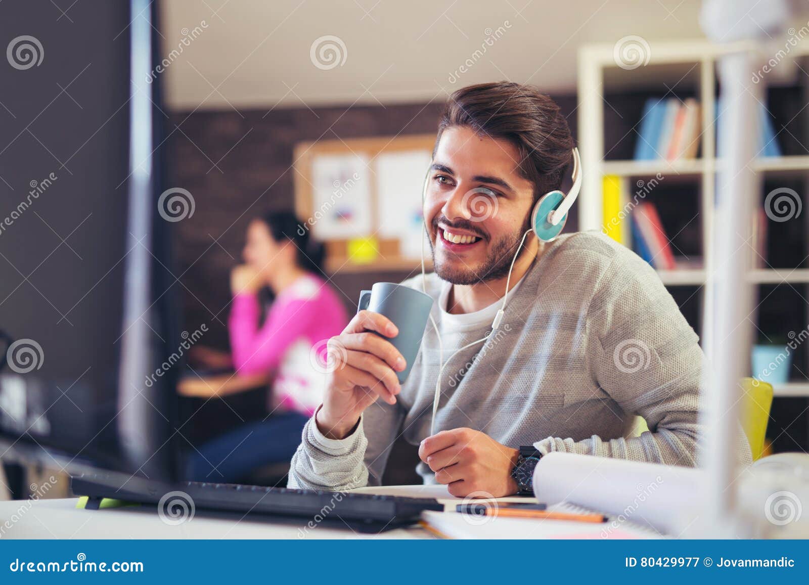 Businessman Using Computer while Listening Music Stock Image - Image of ...