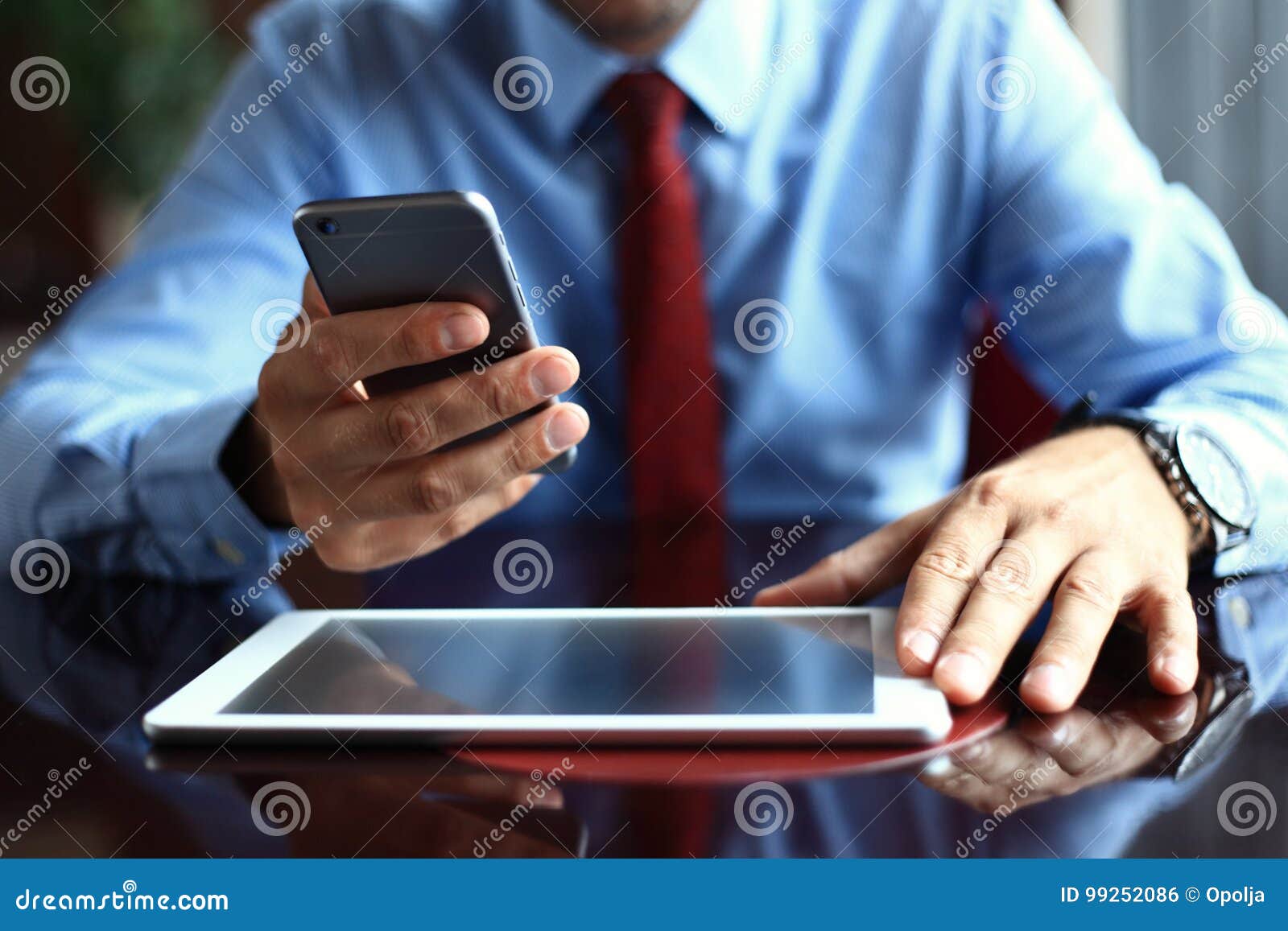 Businessman Using Digital Tablet Computer with Modern Mobile Phone. New ...