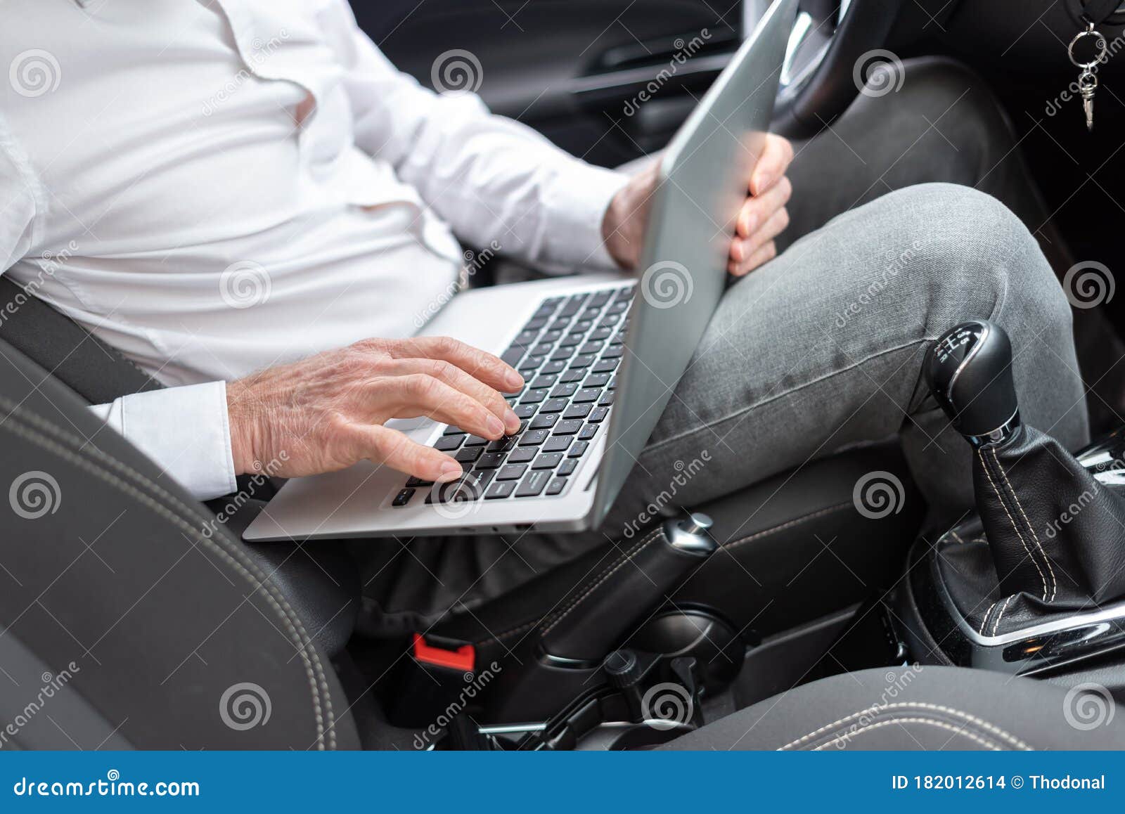 Businessman Using His Laptop in Car Stock Photo - Image of steering ...