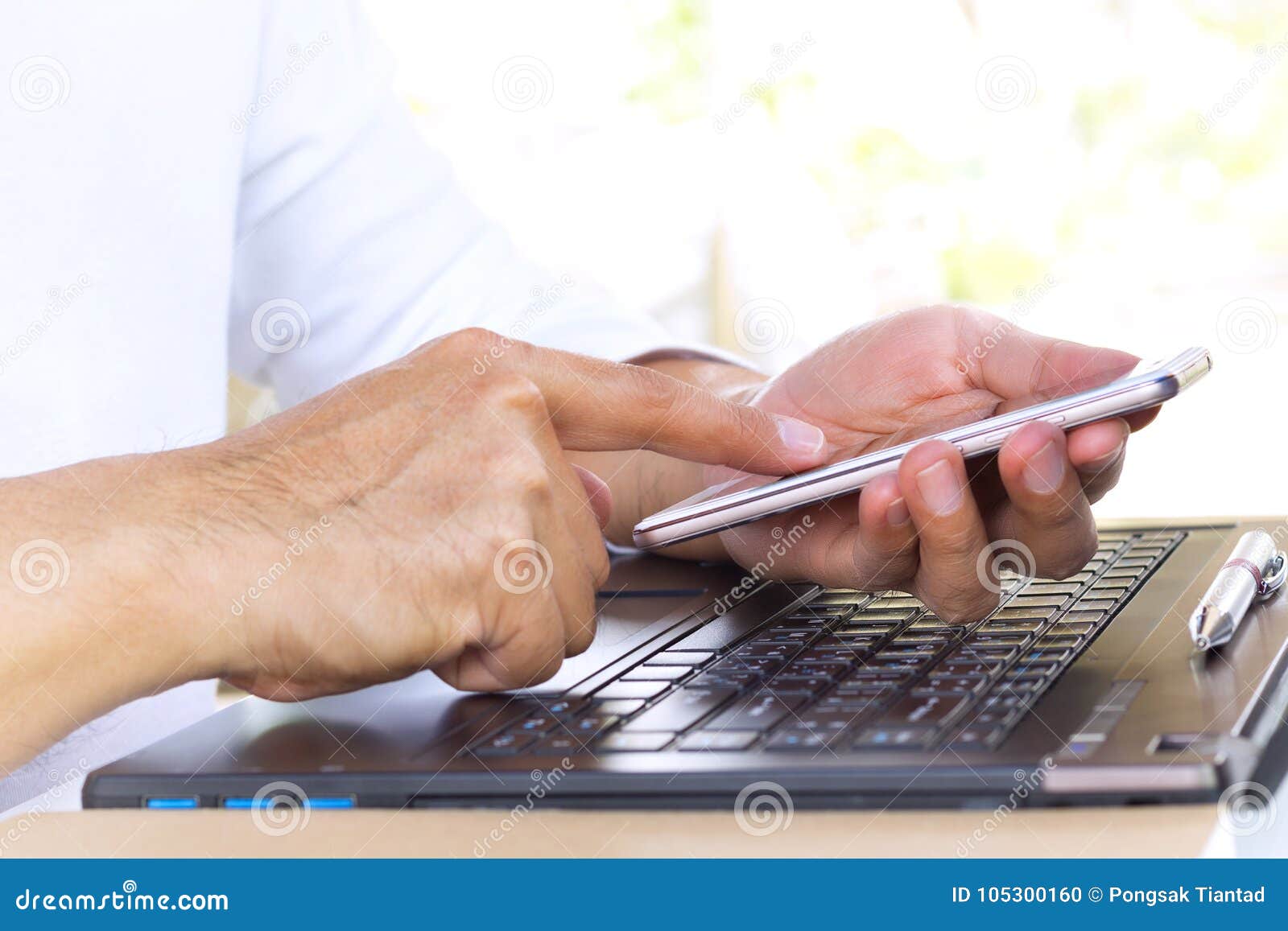 Businessman Using His Laptop Computer and Smartphone. Stock Photo ...