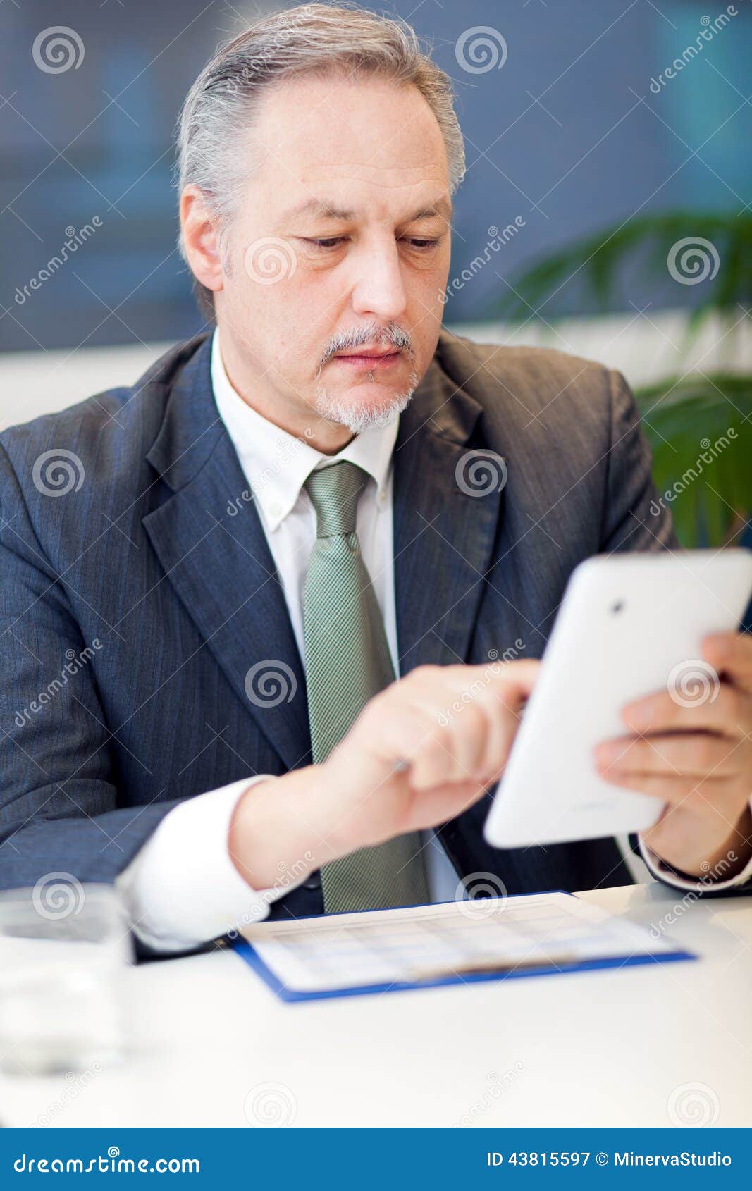 Businessman Using His Tablet in His Office Stock Image - Image of ...
