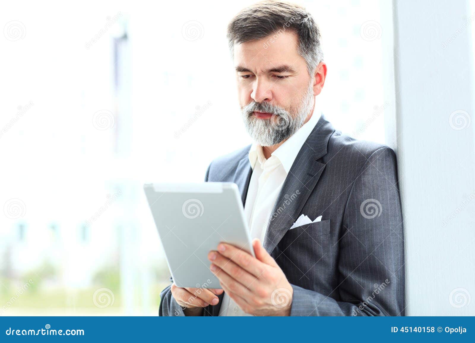 Businessman Using His Tablet in the Office Stock Photo - Image of ...