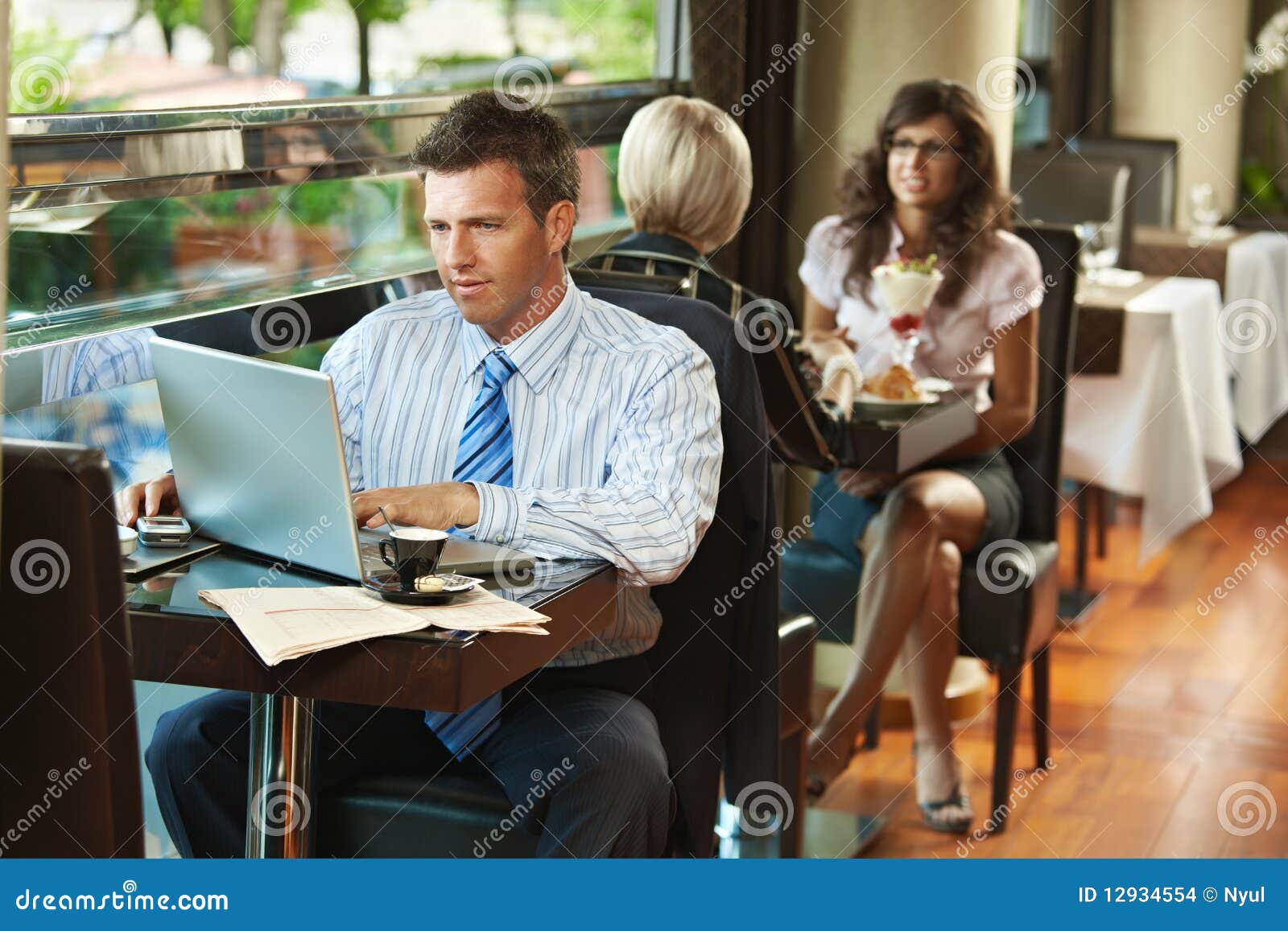 Businessman Using Laptop In Cafe Stock Photo - Image of cream ... Businessman Using Laptop In Cafe Stock Photo - Image of cream ...