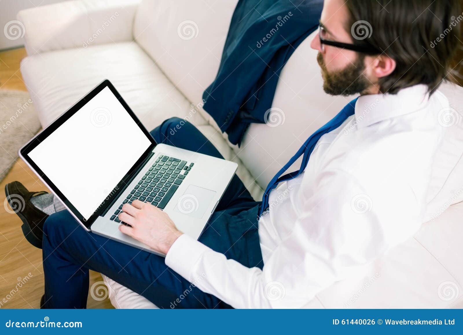 Businessman Using Laptop on the Couch Stock Photo - Image of domestic ...