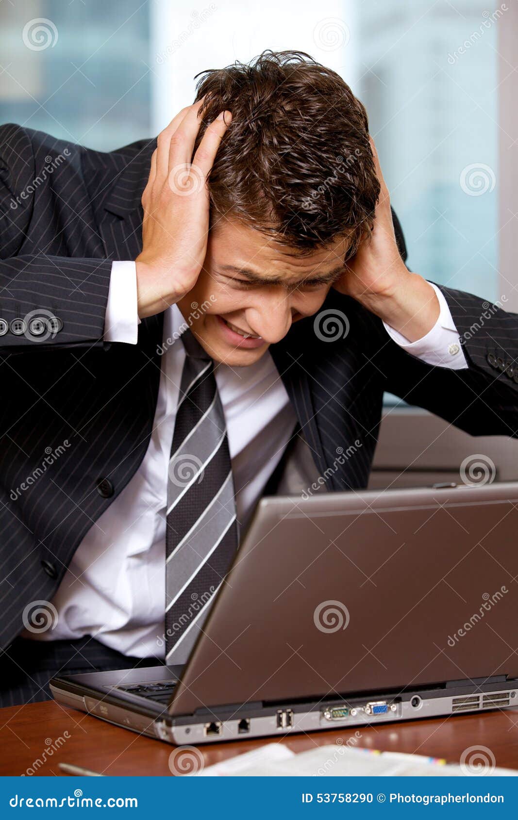 Businessman Using Laptop with Head in Hands Stock Photo - Image of ...