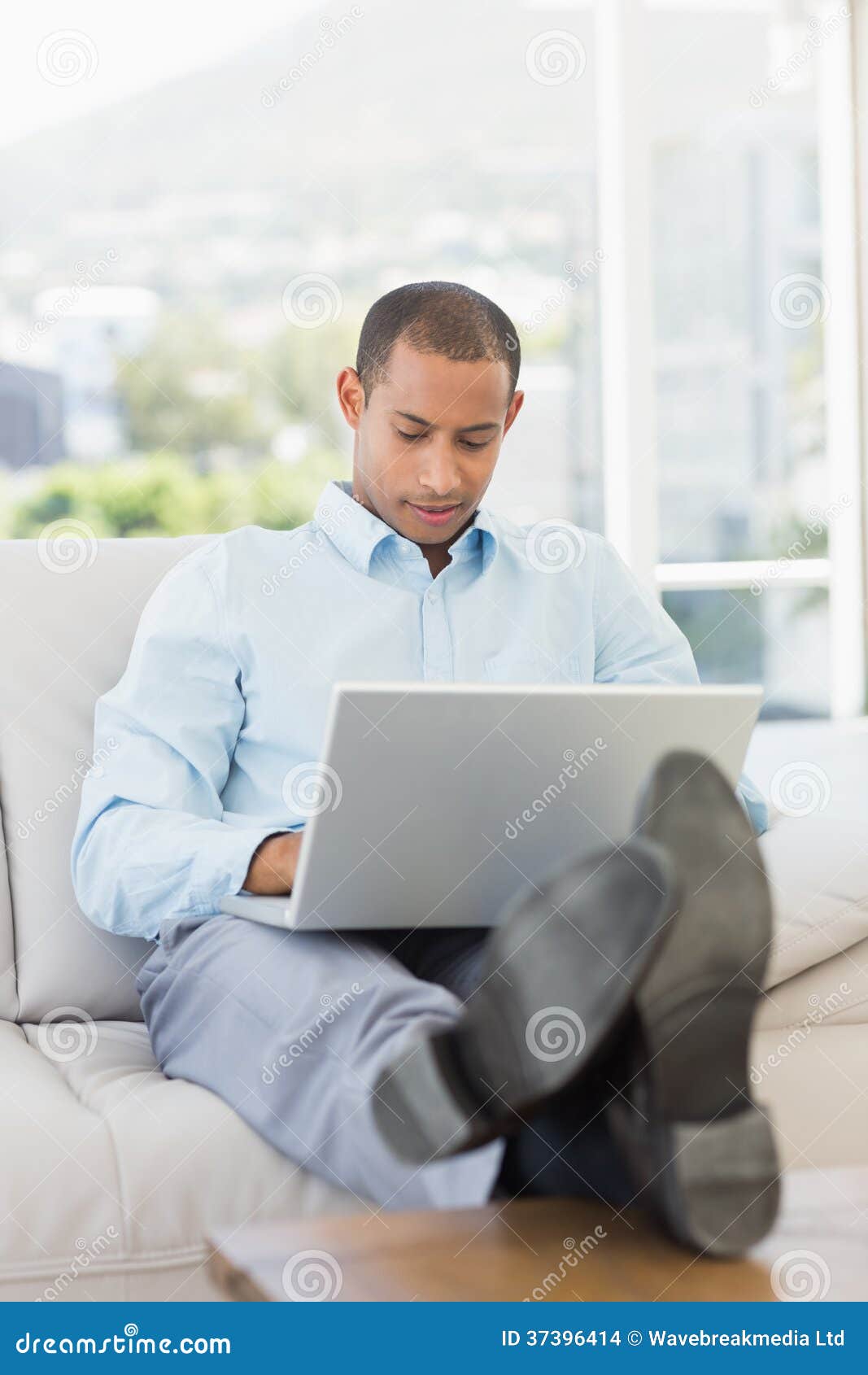 Businessman Using Laptop with His Feet Up Stock Photo - Image of view ...