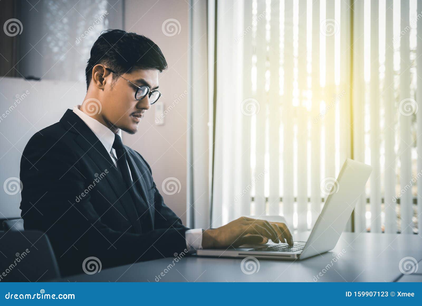 Businessman Using Laptop at Office Desk Stock Image - Image of ...