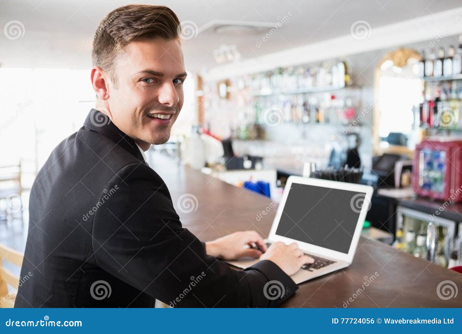 Businessman Using Laptop in Restaurant Stock Photo - Image of device ...