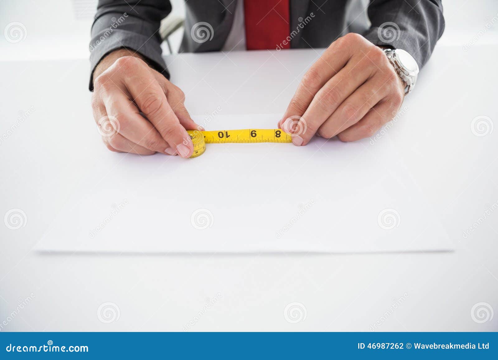 Businessman Using Measuring Tape at Desk Stock Photo - Image of ...