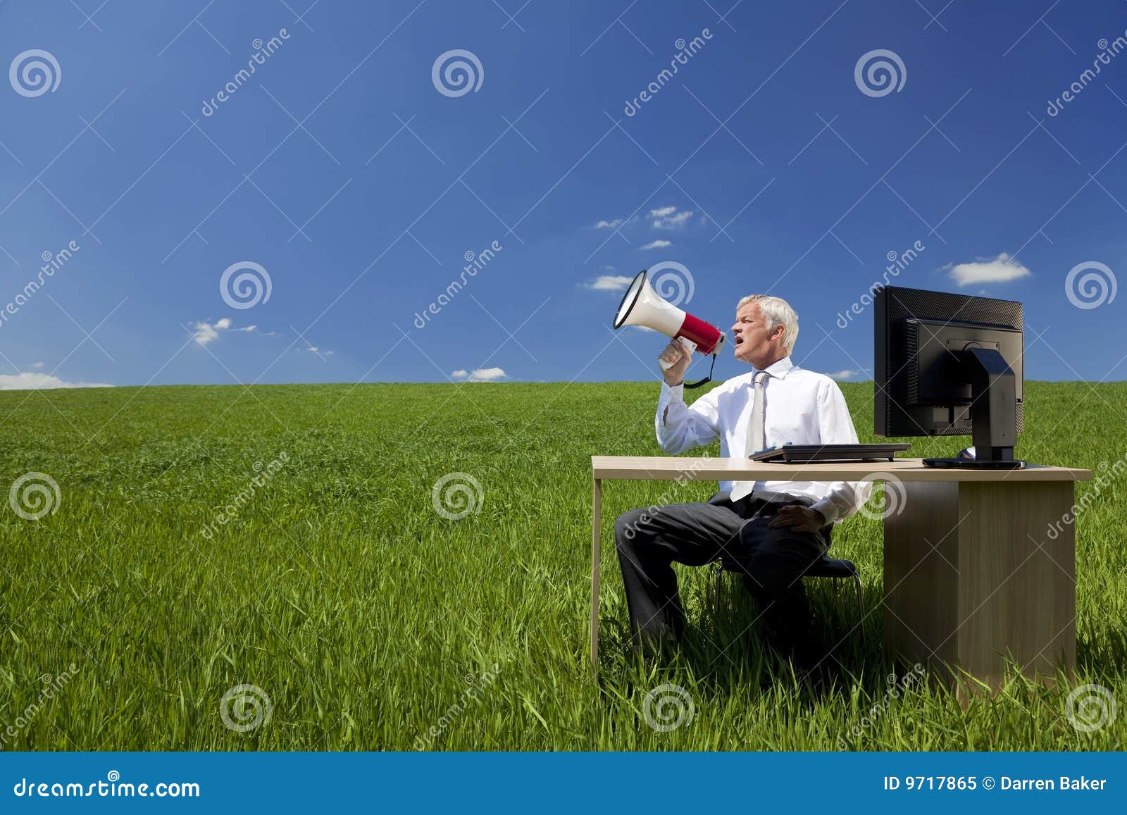 Businessman Using Megaphone in a Field Stock Image - Image of ...