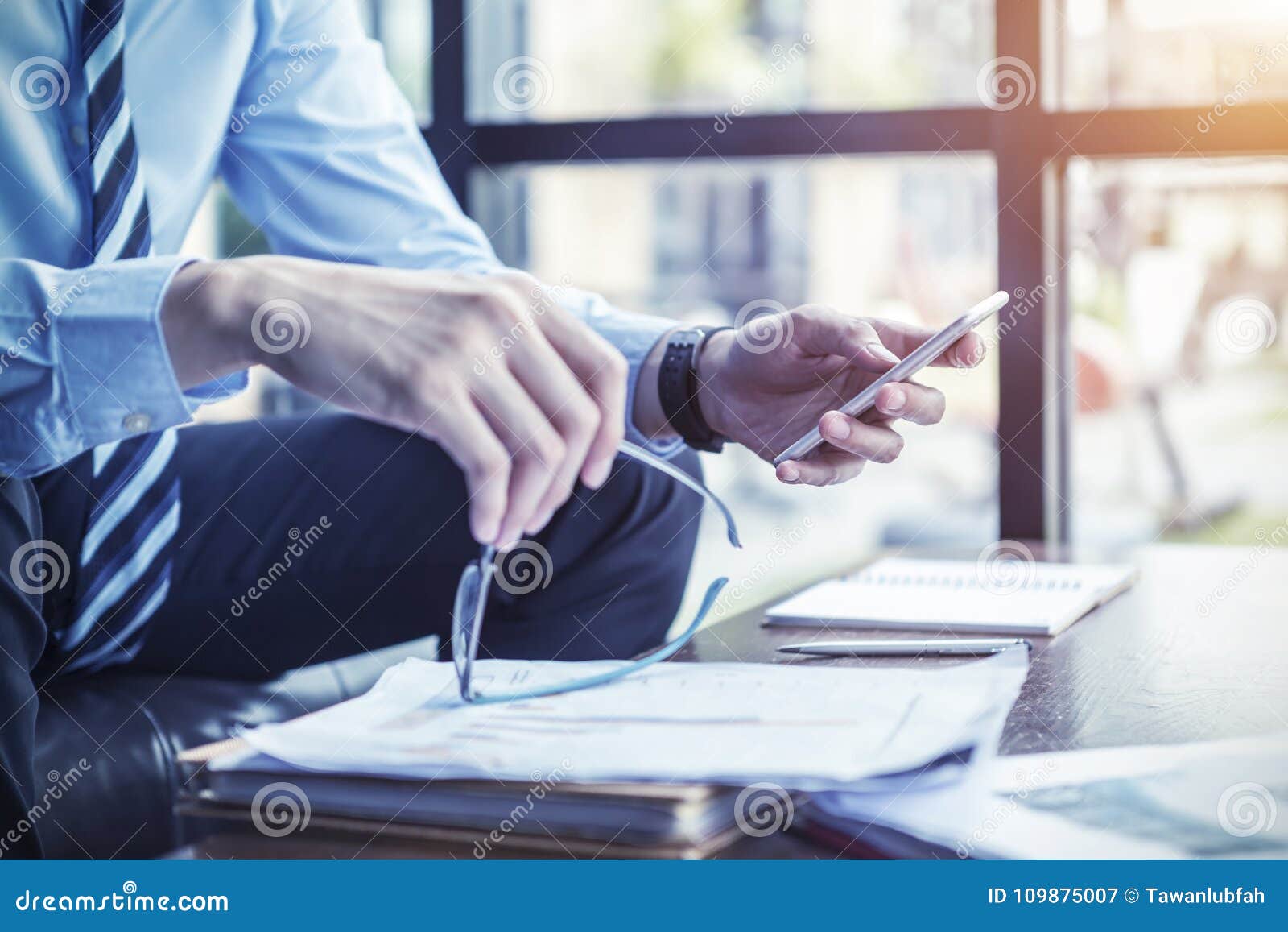 Businessman Using Mobile Checking E-mail while Working in Office Stock ...