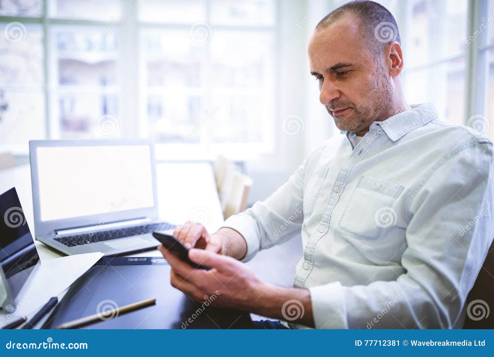 Businessman Using Mobile Phone at Desk Stock Image - Image of clothing ...