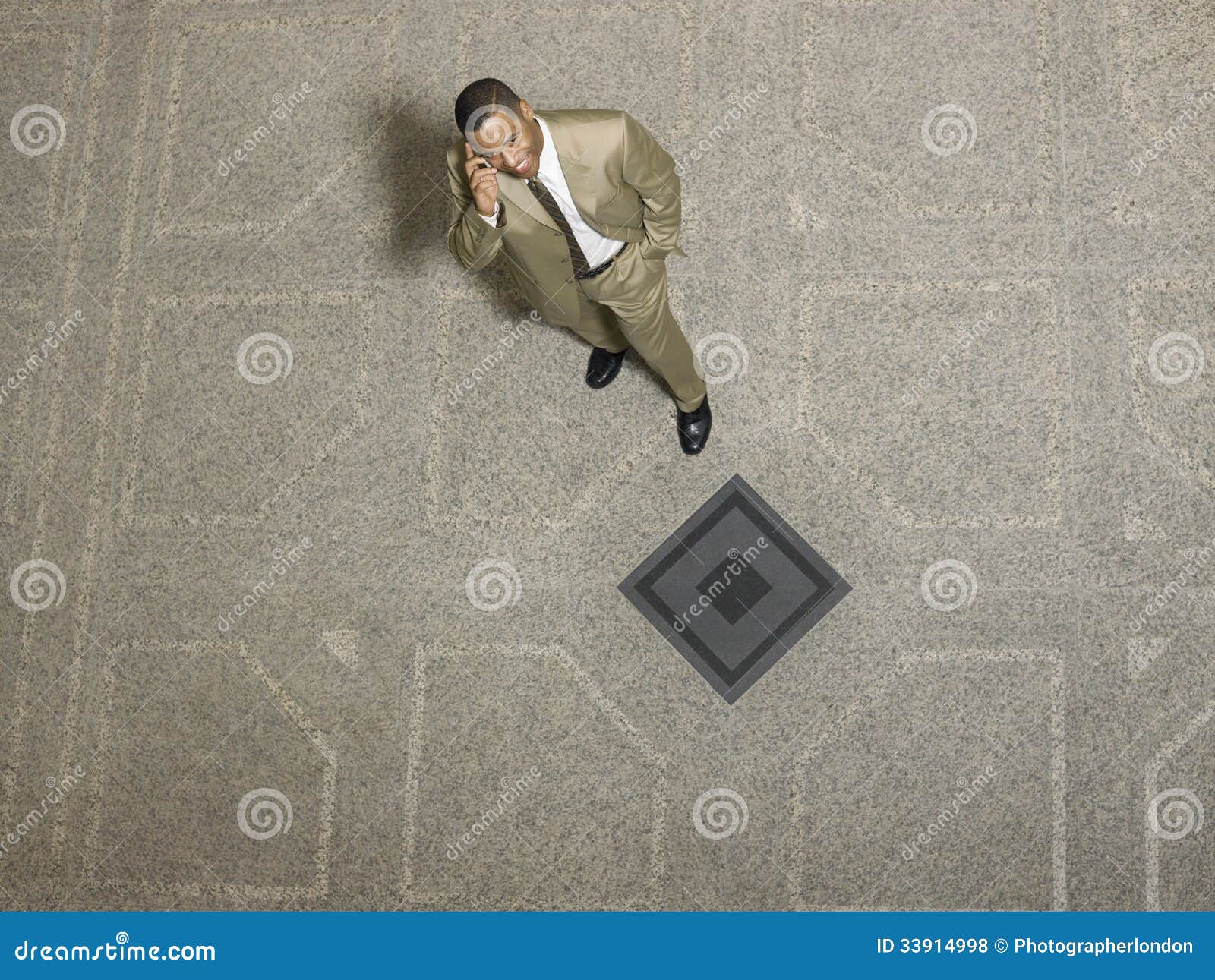 Businessman Using Mobile Phone on Floor Stock Photo - Image of african ...