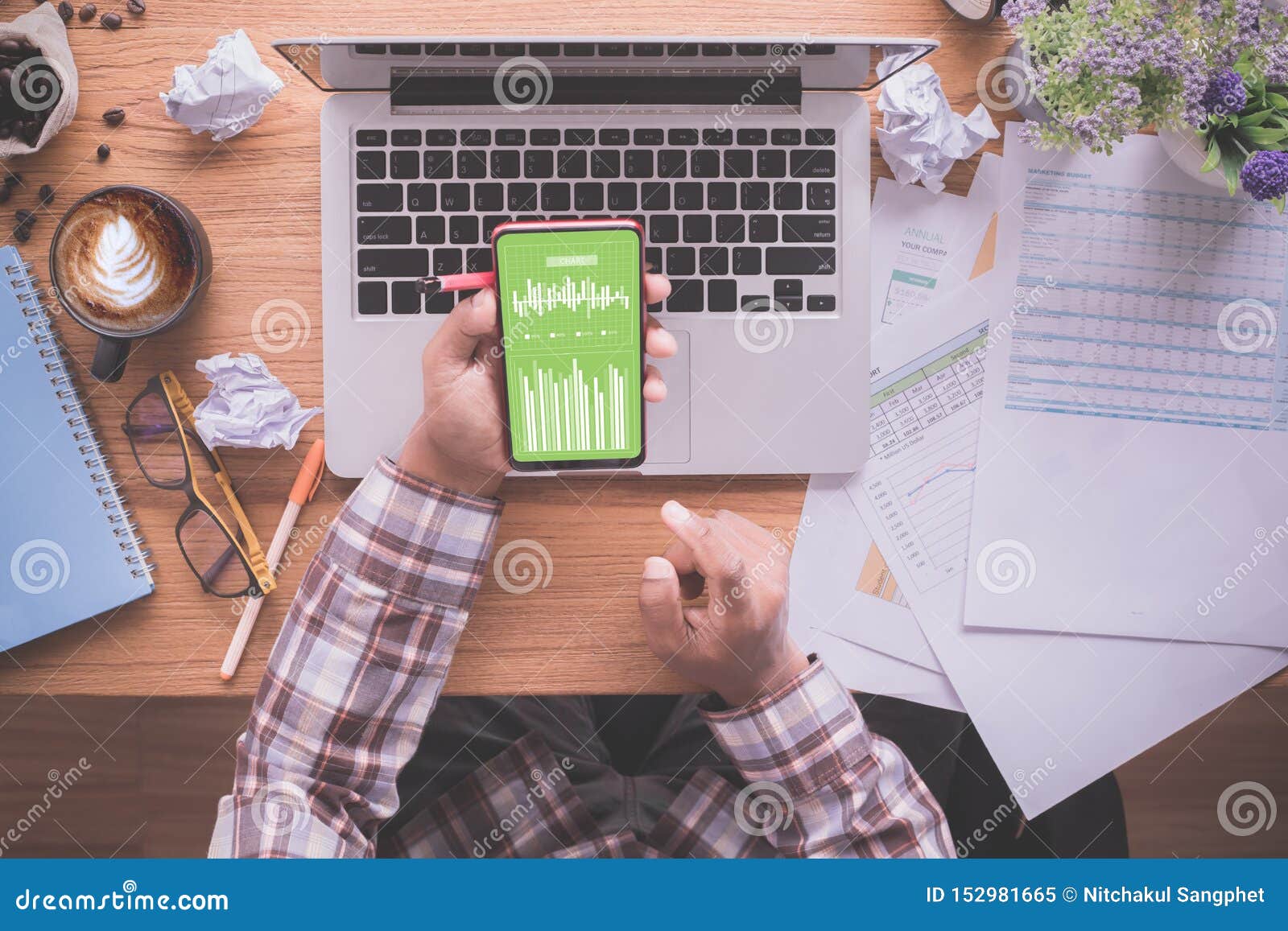 Businessman Using Mobile Phone with Mock Up Chart Report on Screen ...