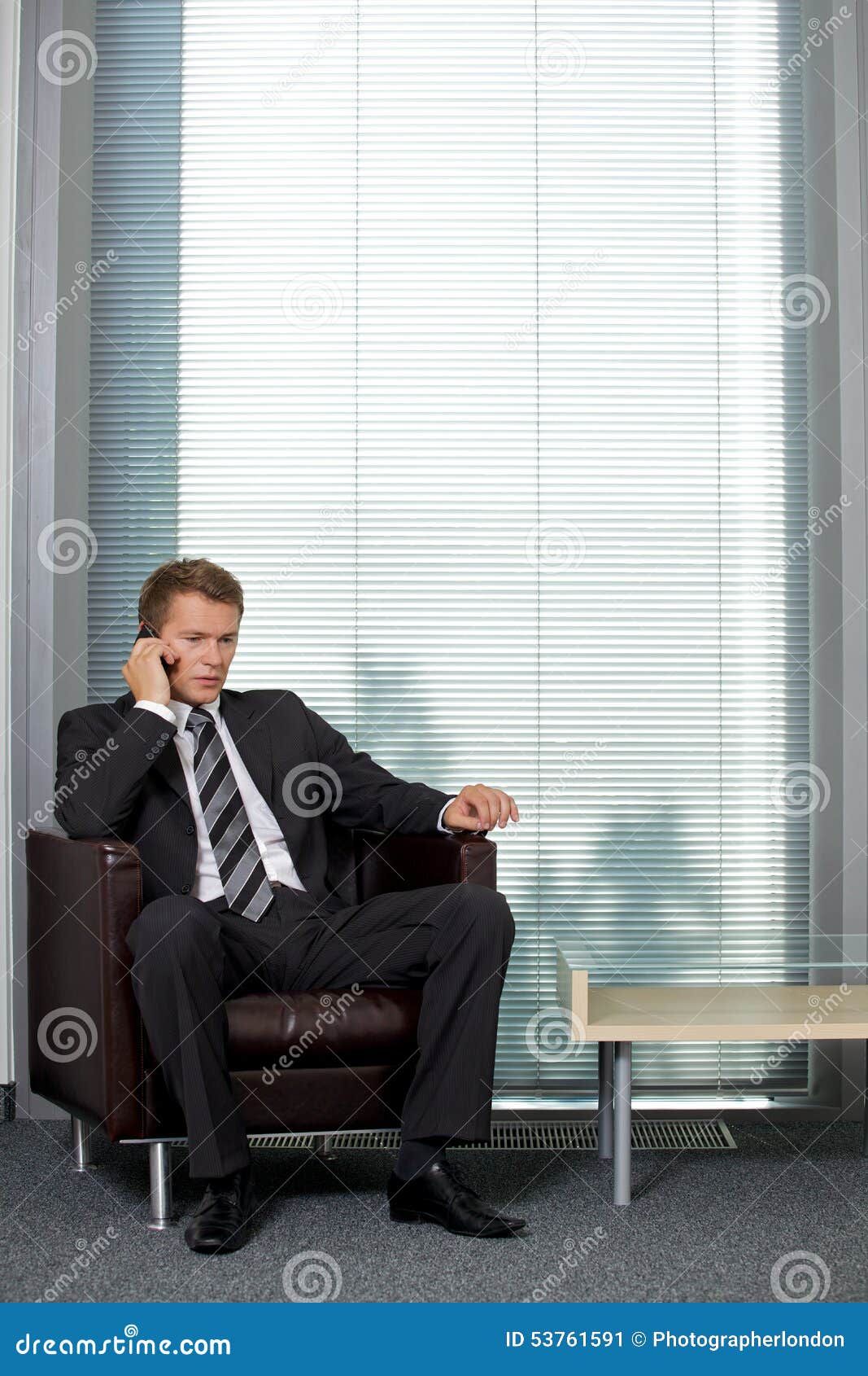 Businessman Using Mobile Phone in Office Stock Image - Image of ...