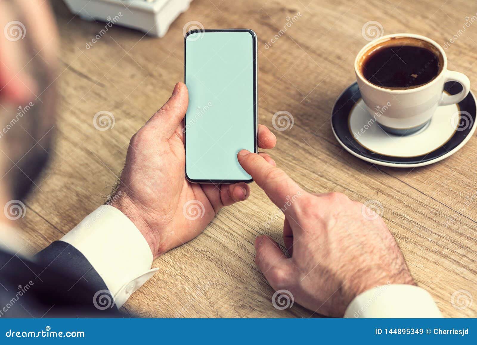 Businessman Using Mockup of Cell Phone at Workplace Stock Image - Image ...