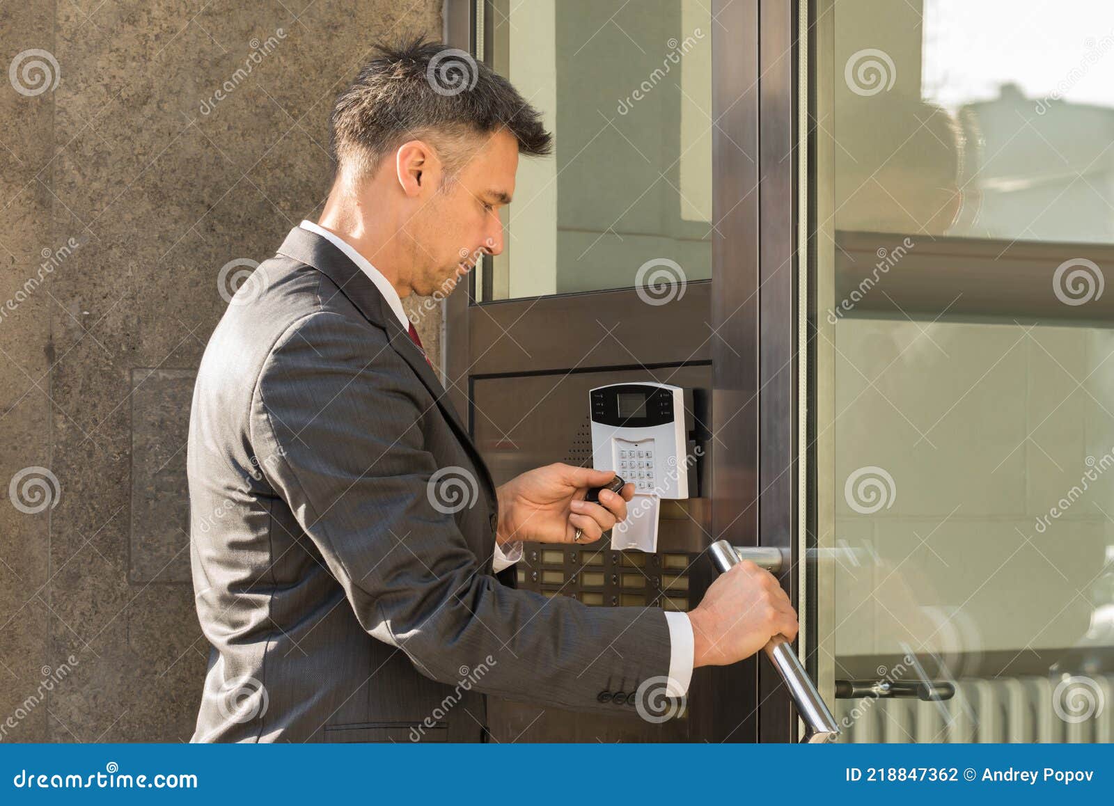 Businessman Using Remote Control for To Open Door Stock Photo - Image ...
