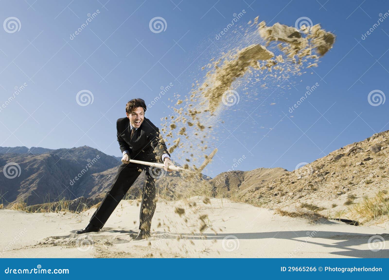 Businessman Using a Shovel in Desert Stock Photo - Image of activity ...