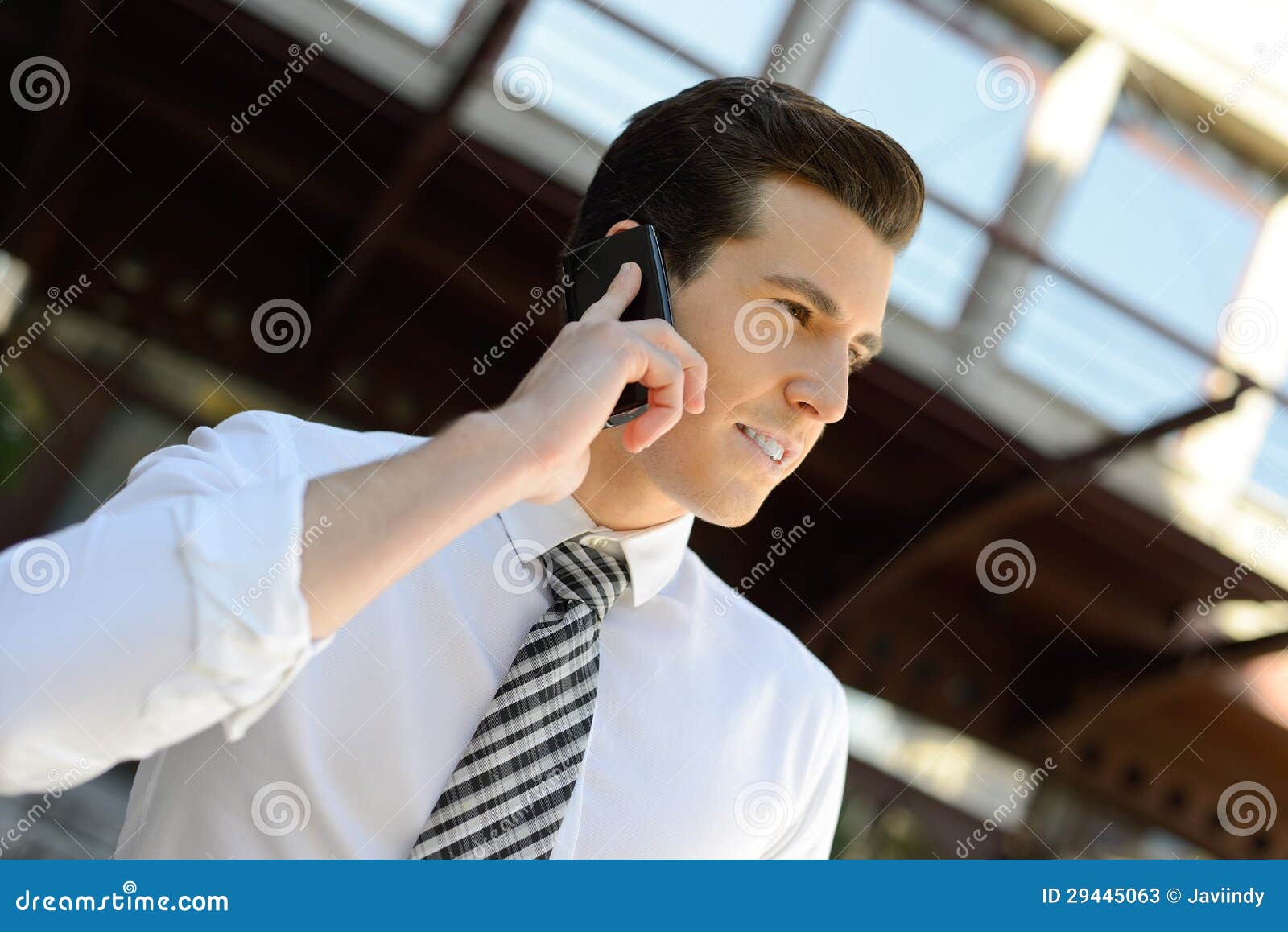 Businessman Using a Smart Phone in an Office Building Stock Image ...